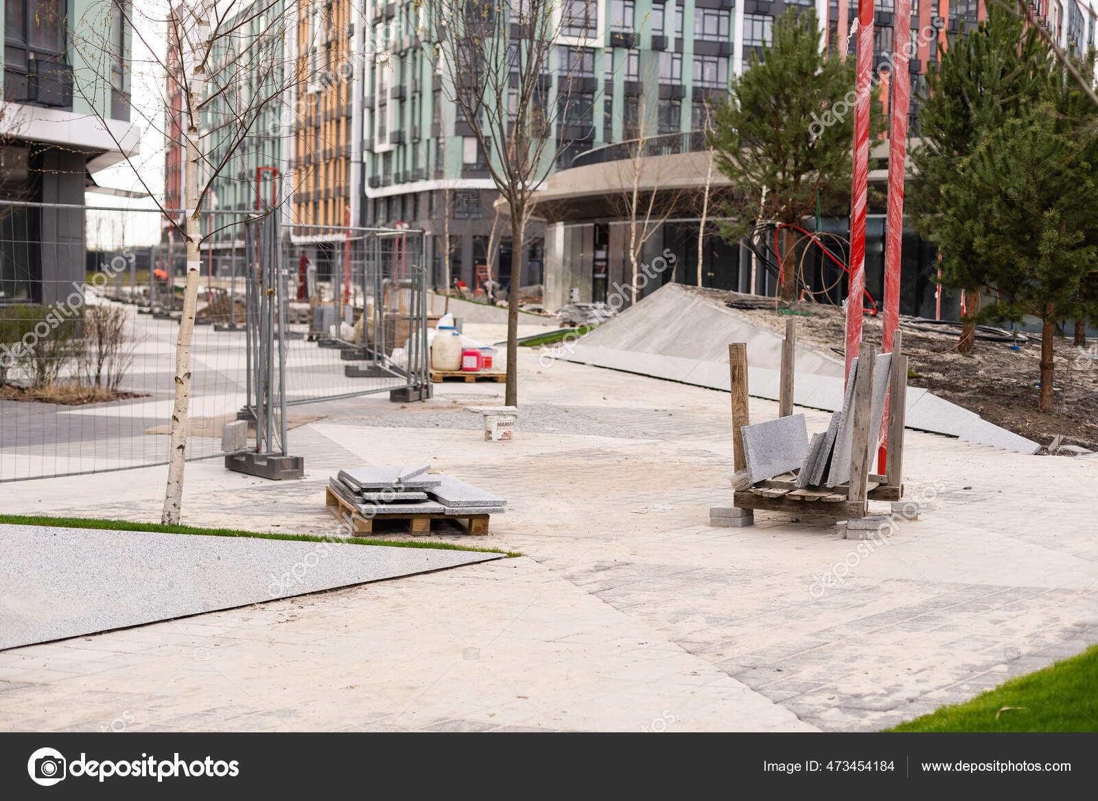 A landscape worker digging a trench during an irrigation system ...
