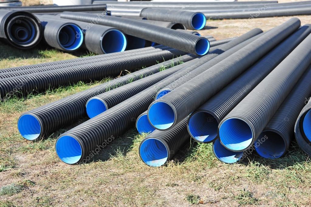 Stacked PVC pipe — Stock Photo © unkas #100930184