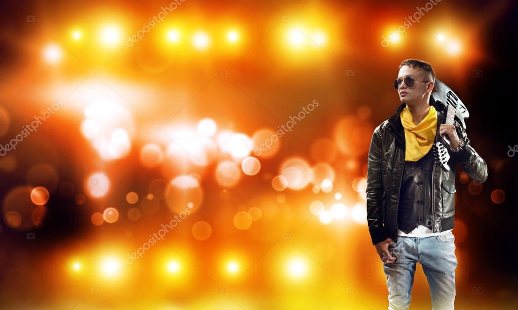 Rock star on stage Stock Photo by ©Khakimullin 119978966