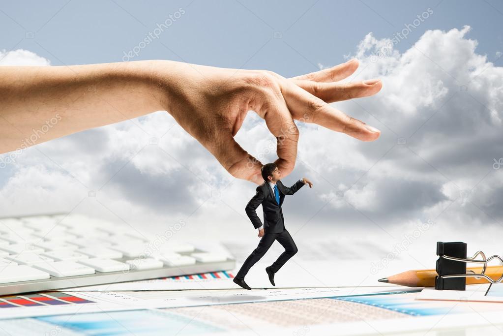 Hand catching man Stock Photo by ©Khakimullin 55088731
