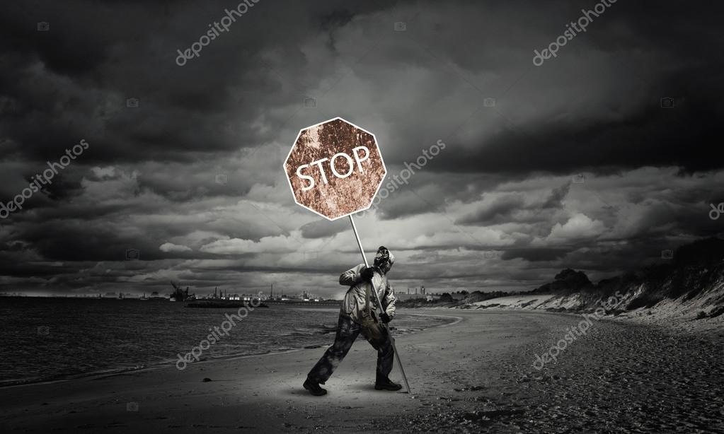 Stalker with precaution stop signboard — Stock Photo © Khakimullin ...
