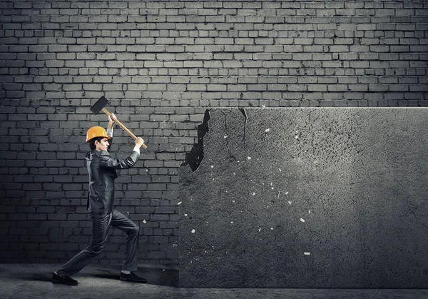 Man breaking wall Stock Photos, Royalty Free Man breaking wall Images ...