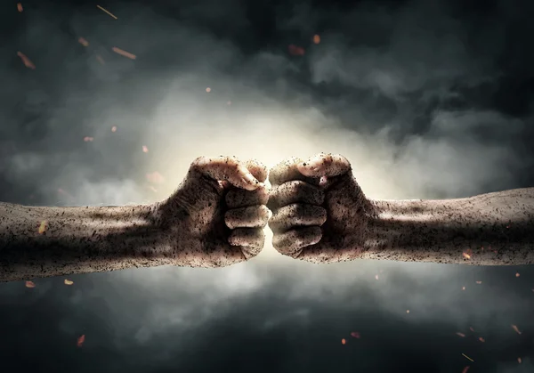 Two fists hitting each other Stock Photo by ©Khakimullin 103125142