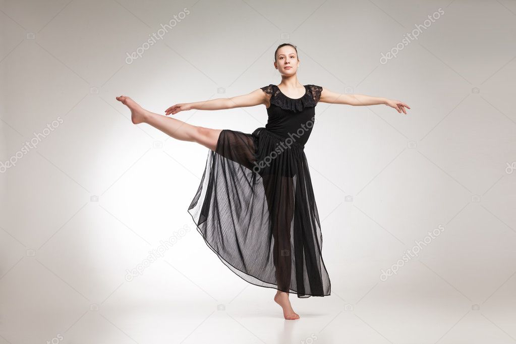 Young ballet dancer wearing black transparent dress dancing — Stock ...