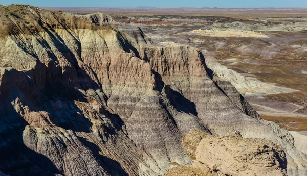 The Painted Desert on a sunny day. Diverse sedimentary rocks and clay ...