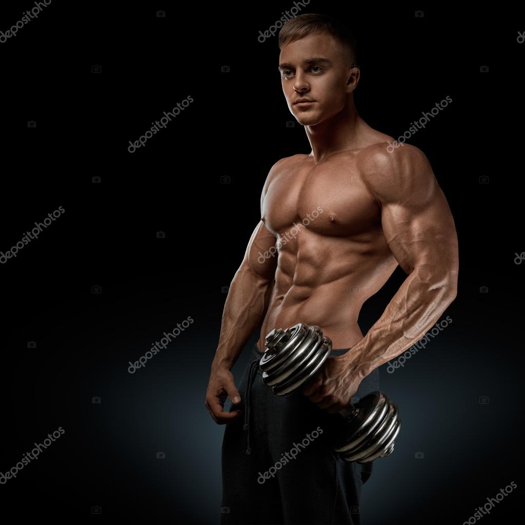 Strong and power bodybuilder doing exercises with dumbbell Stock Photo ...