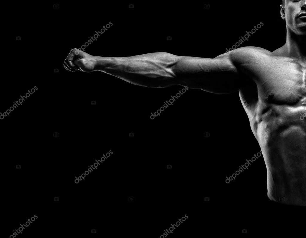 Handsome muscular bodybuilder posing and keeping arms outstretch Stock ...