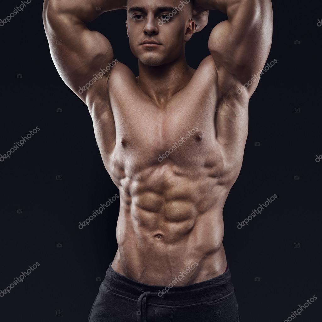 Muscular and fit young bodybuilder fitness male model Stock Photo by ...
