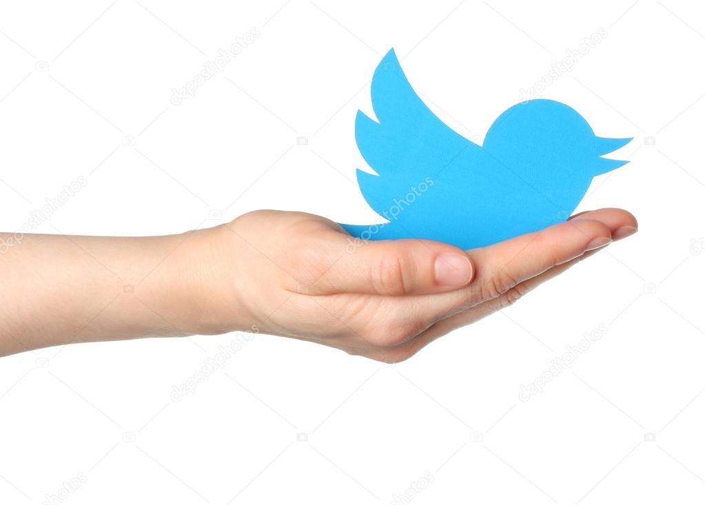 Hand holds twitter logotype bird printed on paper — Stock Editorial ...