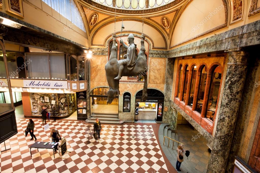 People walk under the famouse artist David Cerny's sculpture Kun (Horse ...