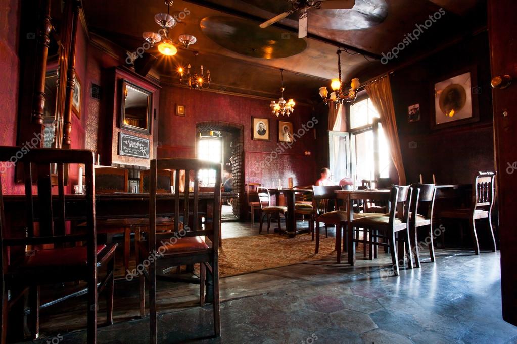 Interior of dark cafe bar with chairs Stock Photo by ©Radiokafka 53310291