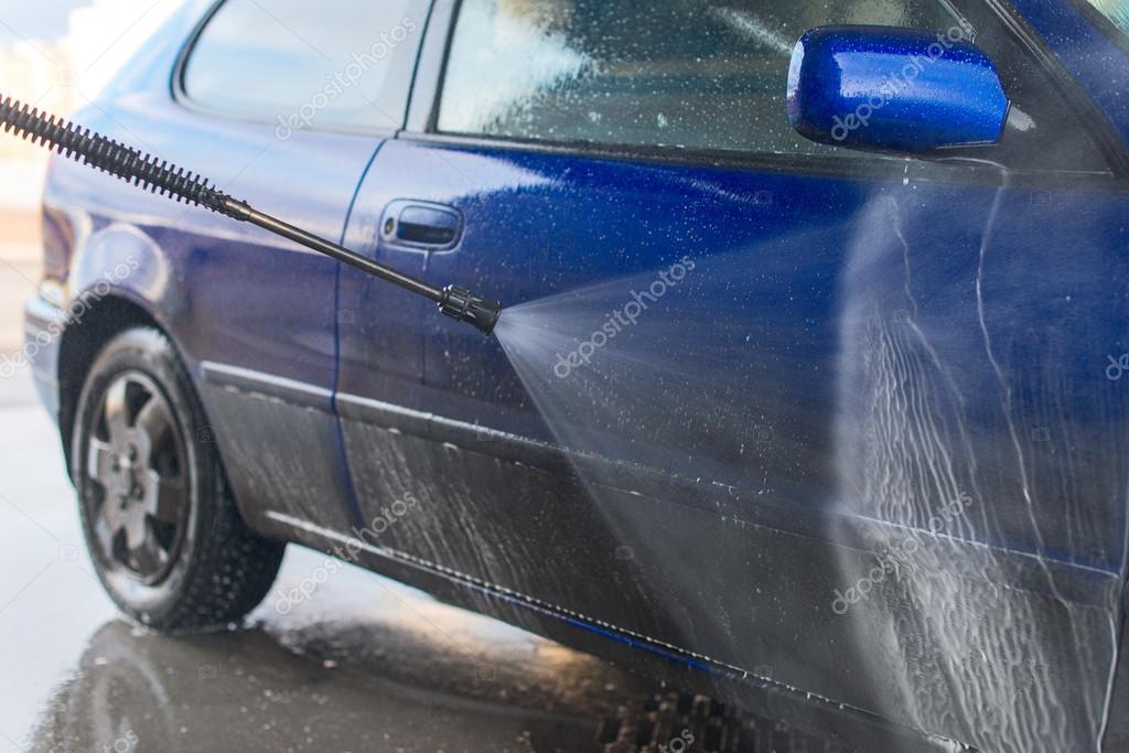 Blue car wash using high pressure water jet. — Stock Photo ...