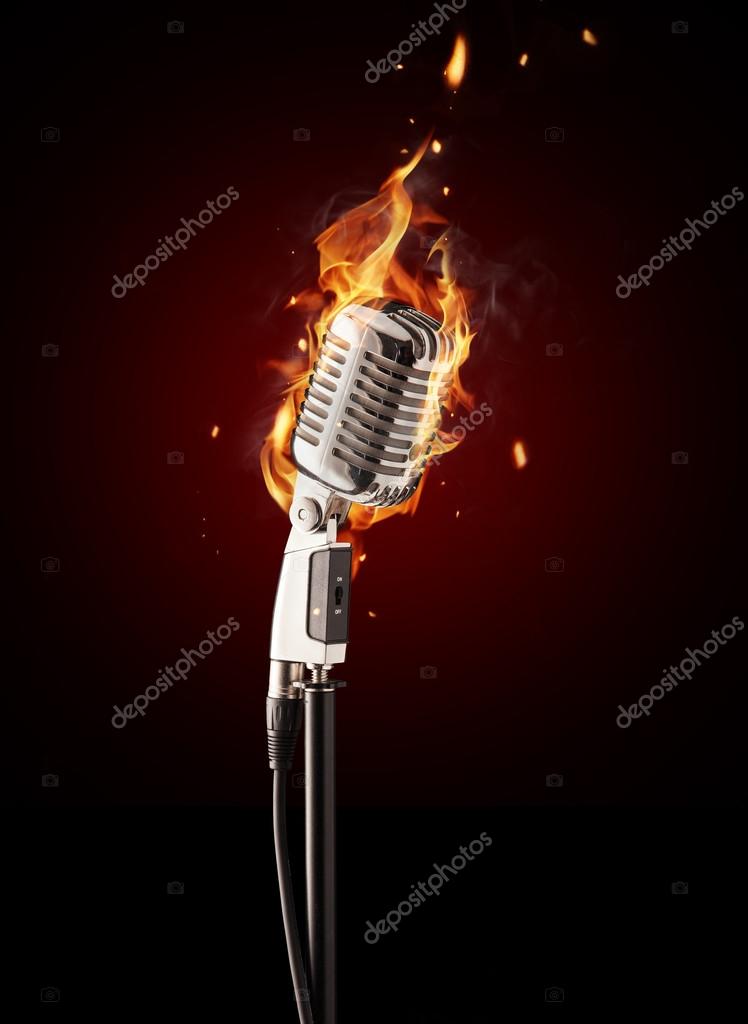 Retro singing microphone in fire Stock Photo by ©jag_cz 75324181