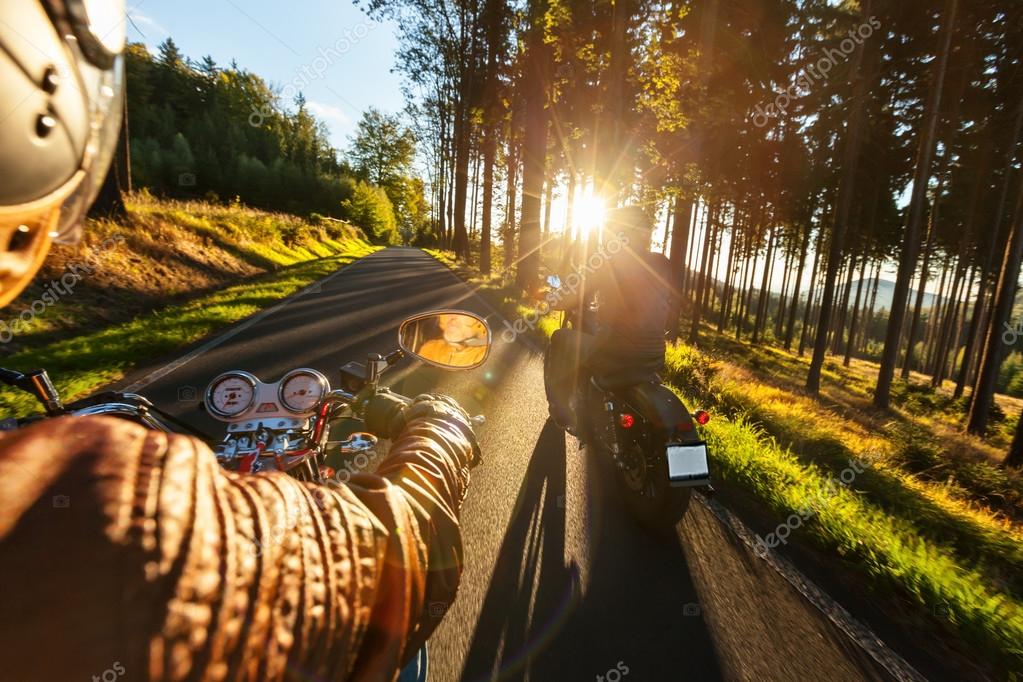 Biker riding motorcycle in sunny morning Stock Photo by ©jag_cz 85634120