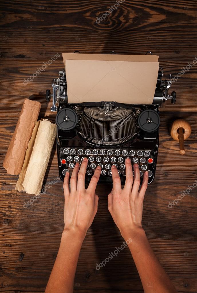 Woman Typing On Typewriter