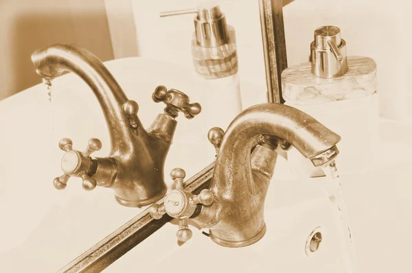 Vintage tap Stock Photo by ©lucianmilasan 81238702