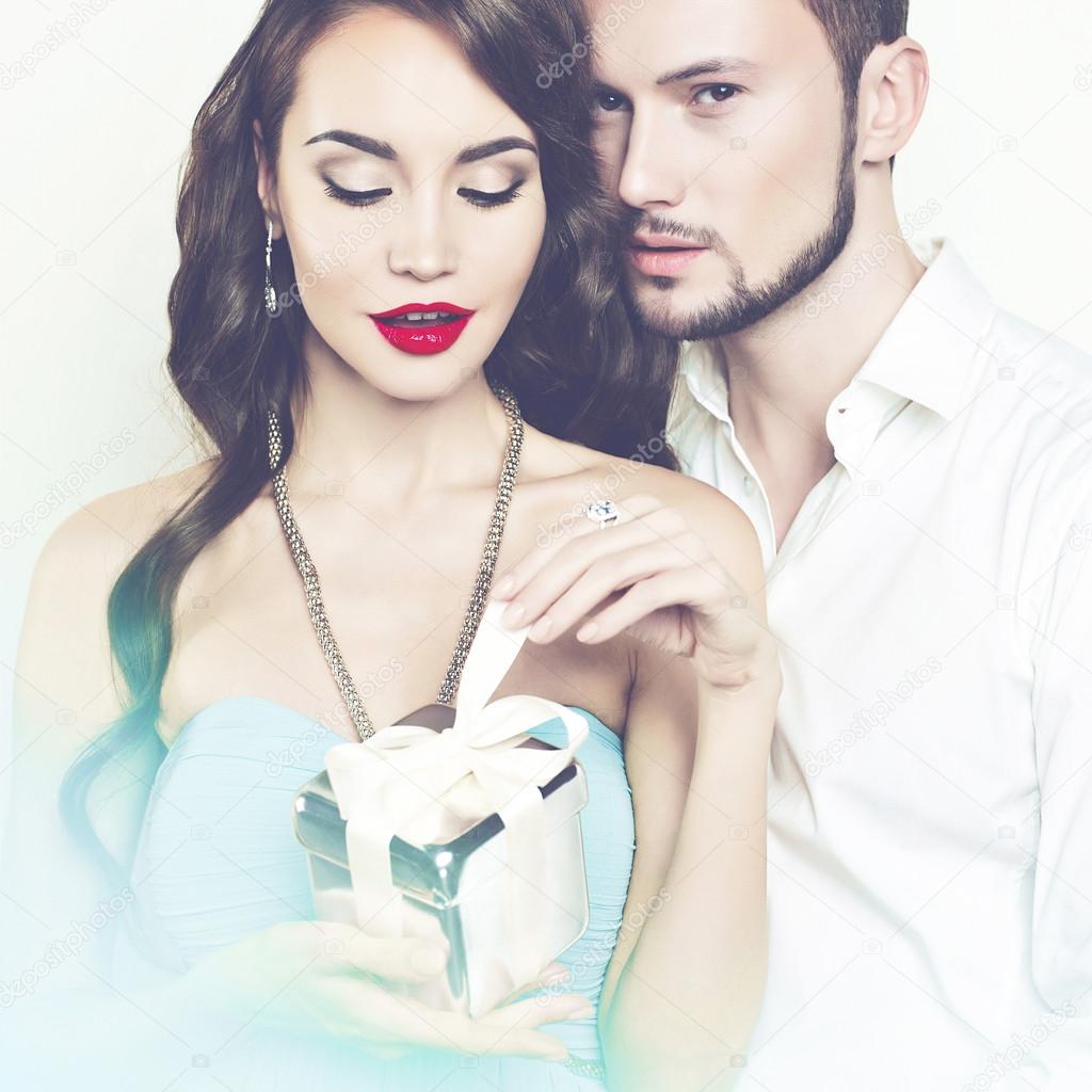 Romantic couple with gift Stock Photo by ©korobkova 62815197