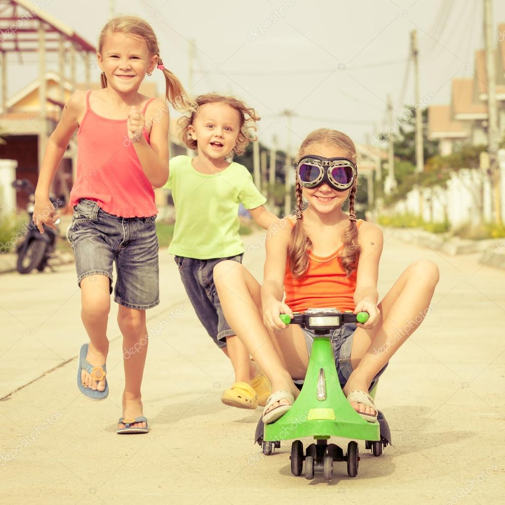 Happy children playing on the road at the day time — Stock Photo ...