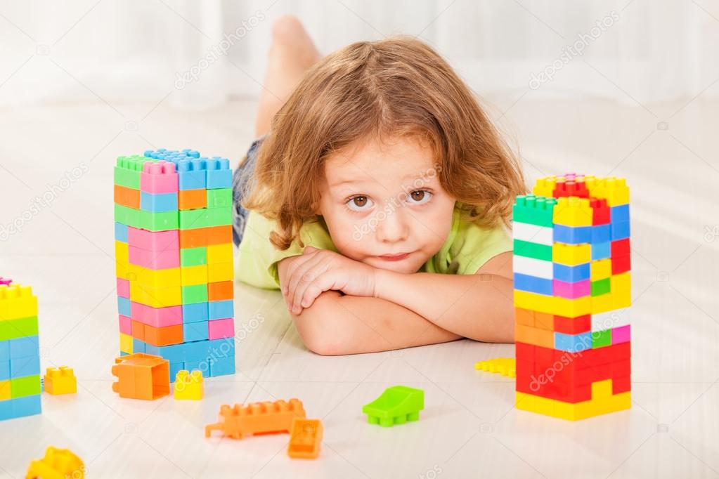 Little boy playing Lego on the floor – Stock Editorial Photo © altanaka ...
