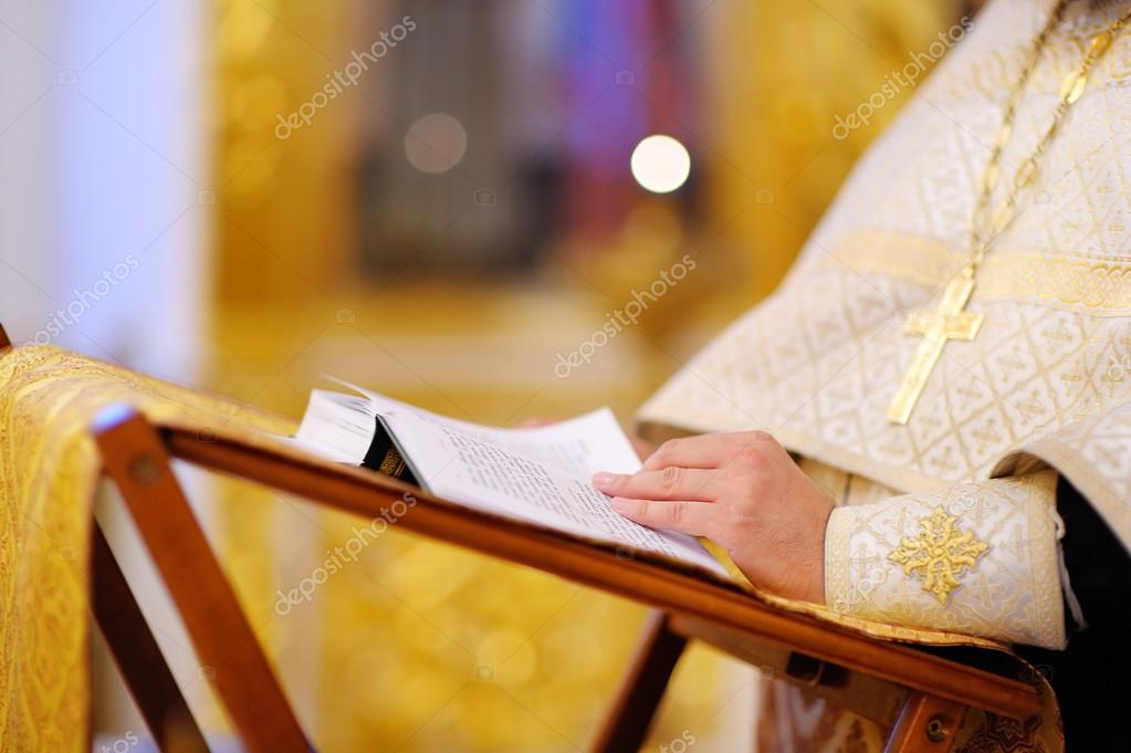 Priest reading church book — Stock Photo © mary_smn #95043388