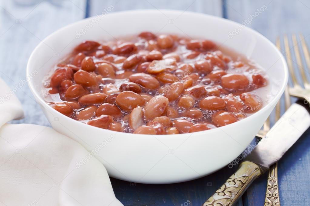 Boiled beans in white dish Stock Photo by ©nataliamylova 113281266