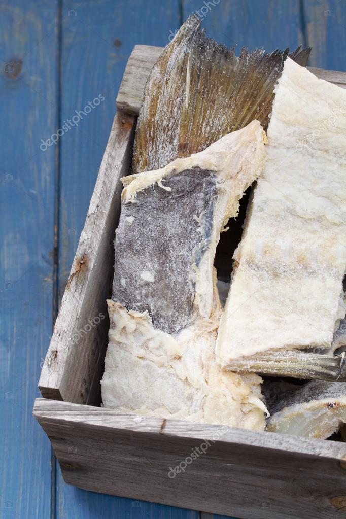 Salted cod fish in wooden box Stock Photo by ©nataliamylova 114773878