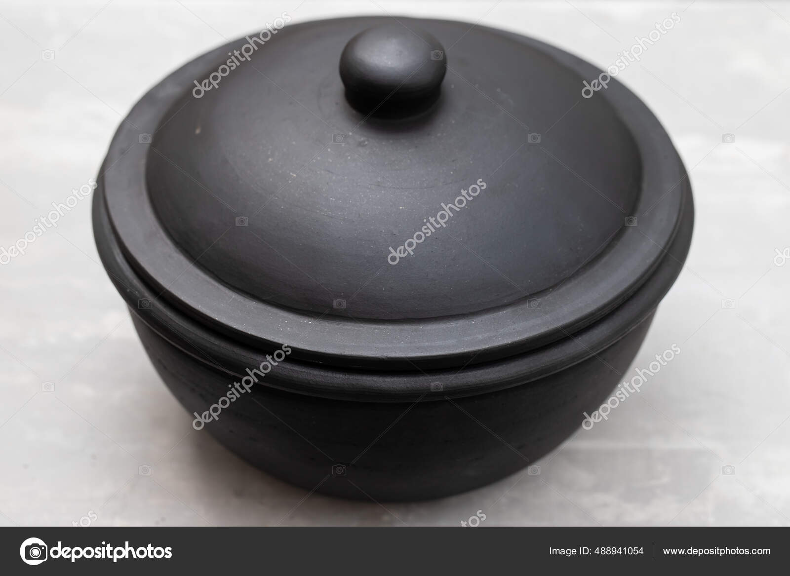 Small beautiful black ceramic pot — Stock Photo © nataliamylova #488941054