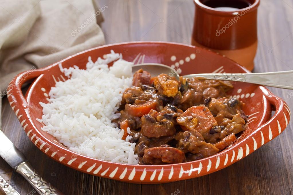 Typical portuguese dish feijoada with rice in ceramic bowl Stock Photo ...