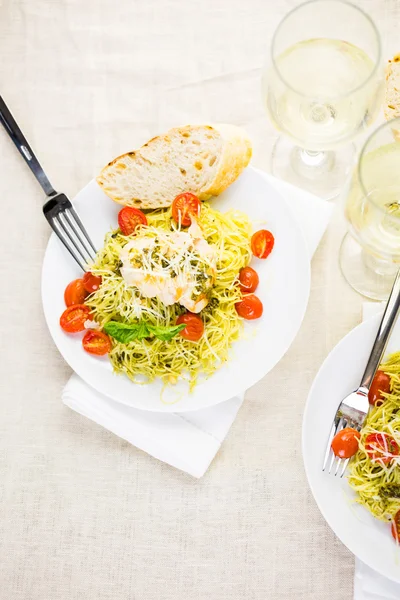 Homemade angel hair pasta with pesto sauce - Stock Image - Everypixel
