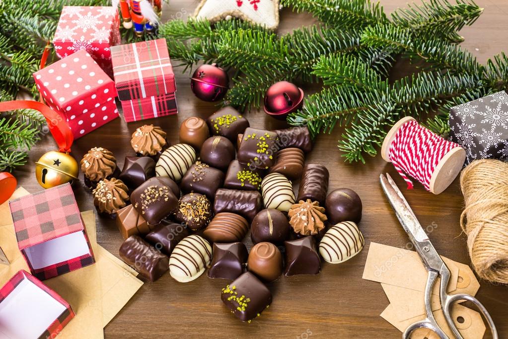 Wrapping assorted chocolates in small boxes Stock Photo by ©urban_light ...