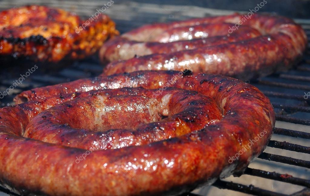 A big roll of grilled delicious traditional African — Stock Photo ...