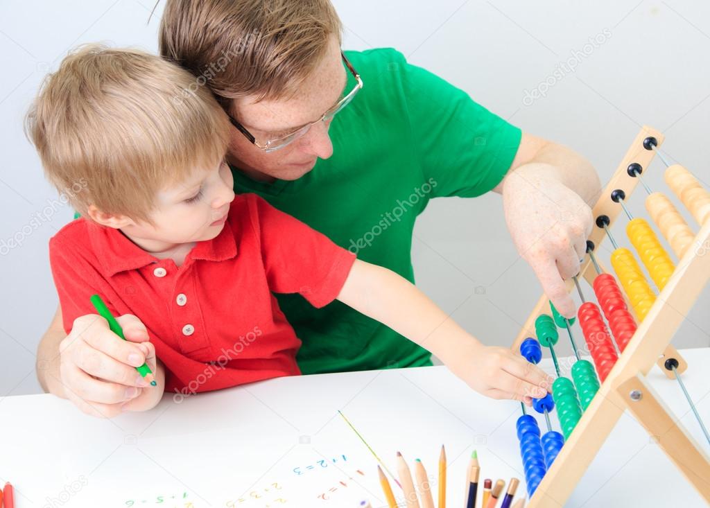 Little boy with teacher learning math, early education Stock Photo by ...