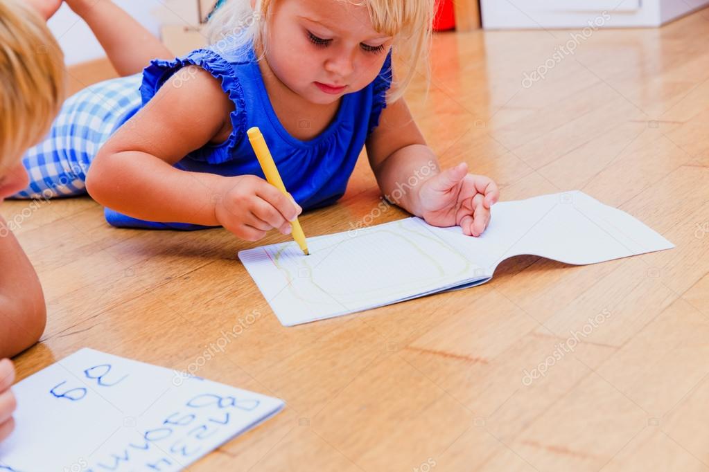 Kids learning to draw and write Stock Photo by ©Nadezhda1906 123483010