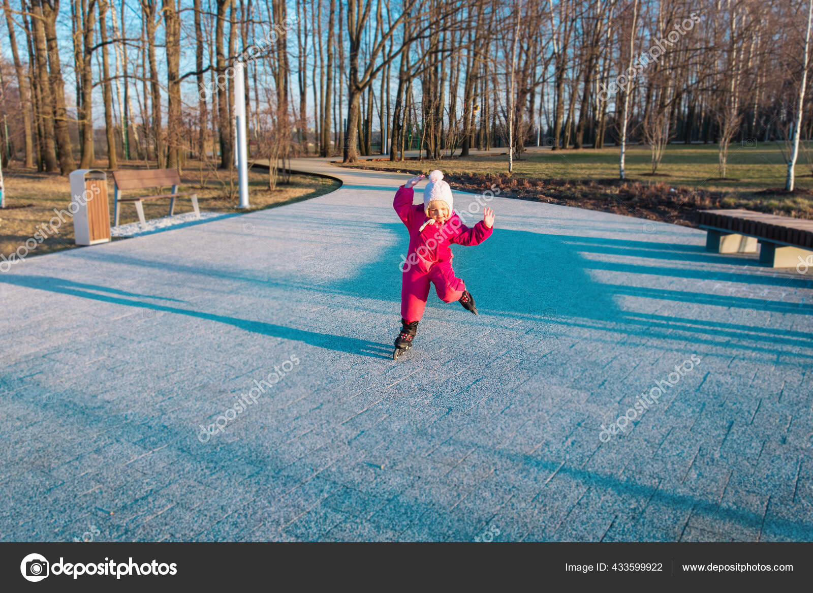 Little girl learning roller skating tricks ourside Stock Photo by ...