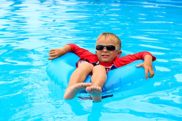Little boy in swimming pool and goggles Stock Photo by ©sakkmesterke ...