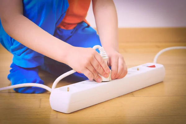 Child playing with electricity Stock Photo by ©Nadezhda1906 64124057
