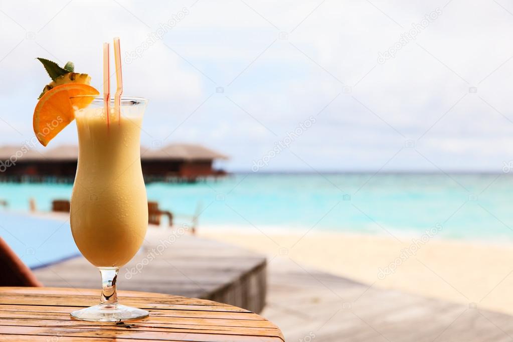 Pina colada on tropical beach Stock Photo by ©Nadezhda1906 82695728