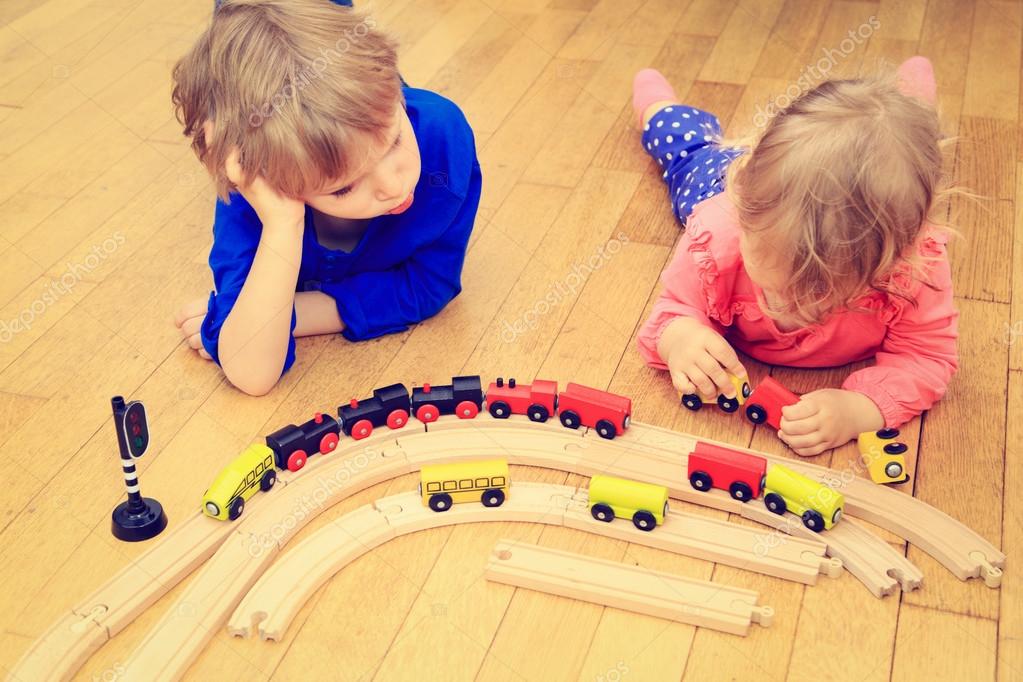 Kids playing with railroad, learning and daycare — Stock Photo ...