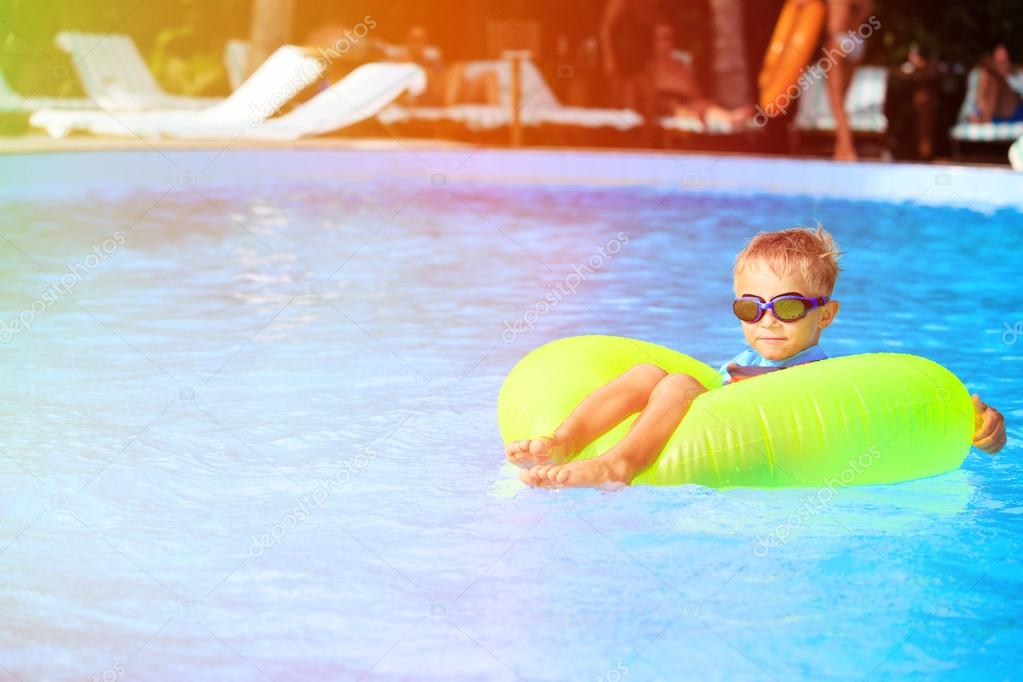 Little boy in life ring fun at the swimming pool Stock Photo by ...