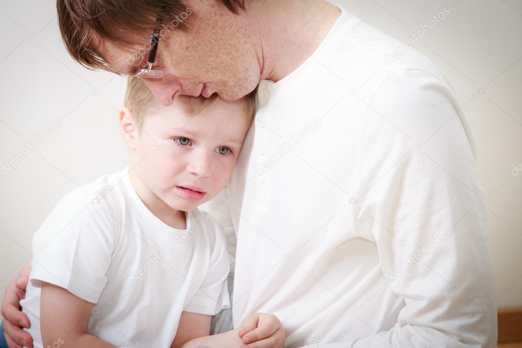 Father comforting son in tears Stock Photo by ©Nadezhda1906 90477498