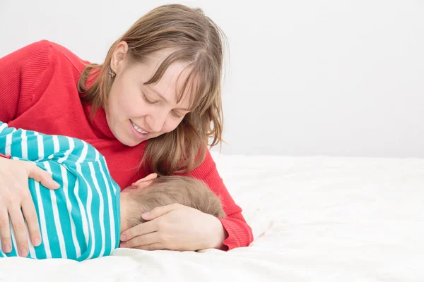 Mother comforting her crying little son - Stock Image - Everypixel