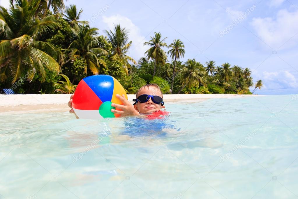 Little boy playing ball on tropical beach Stock Photo by ©Nadezhda1906 ...