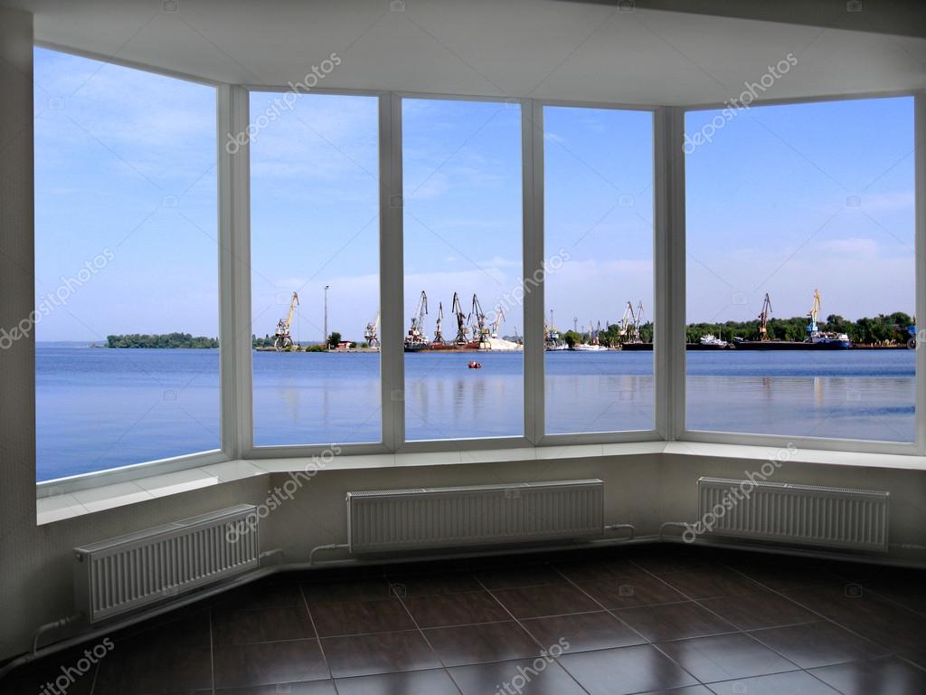 Window overlooking the sea port docks and cranes — Stock Photo ...