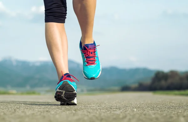 Runner athlete feet running on road - Stock Image - Everypixel