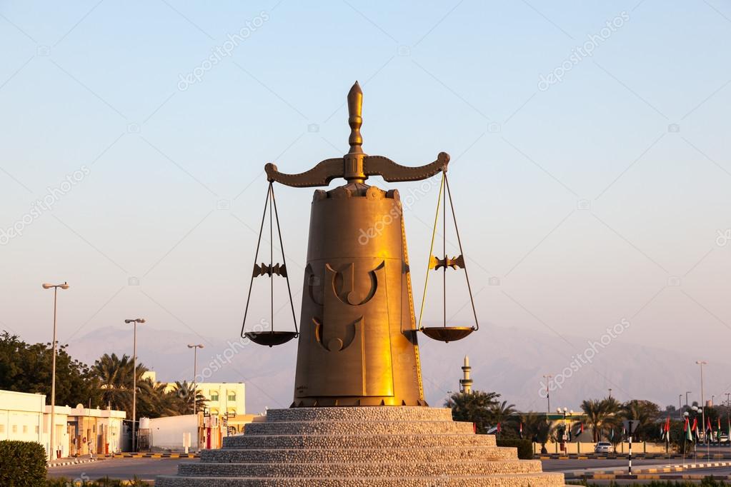 RAS AL KHAIMAH, UAE - DEC 17: Roundabout with scales of justice statue ...