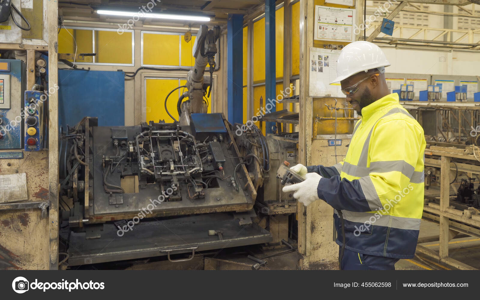 Black African American Man Engineer Worker Control Smart Robot Welding ...