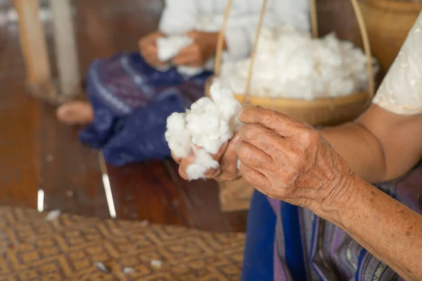 Local people hands making textile cloth fabric cotton fiber, handmade ...