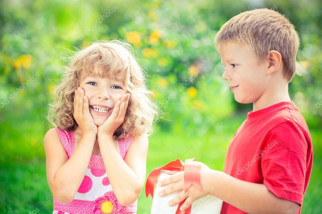 Happy children with present Stock Photo by ©Yaruta 66756225