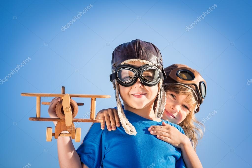 Children playing with toy airplane Stock Photo by ©Yaruta 67463553