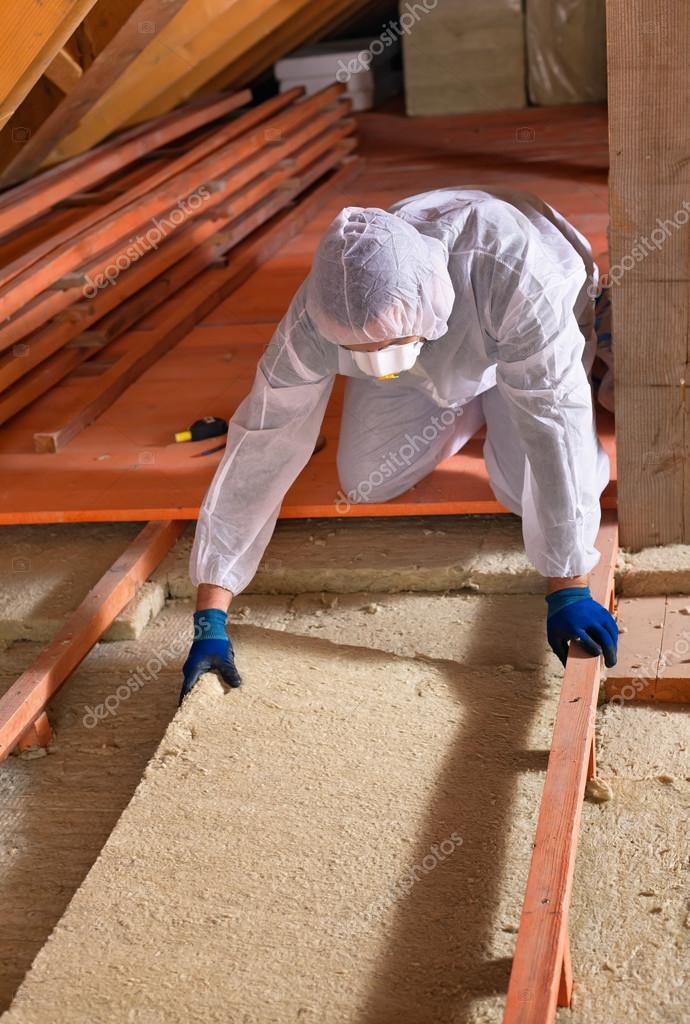 Man laying thermal insulation layer - wearing protective clothin Stock ...